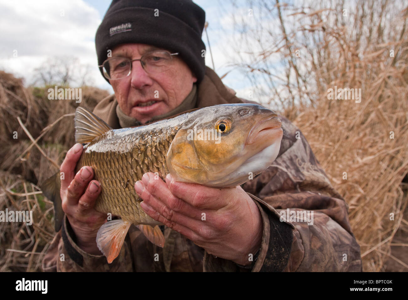 An angler displays his catch Stock Photo - Alamy