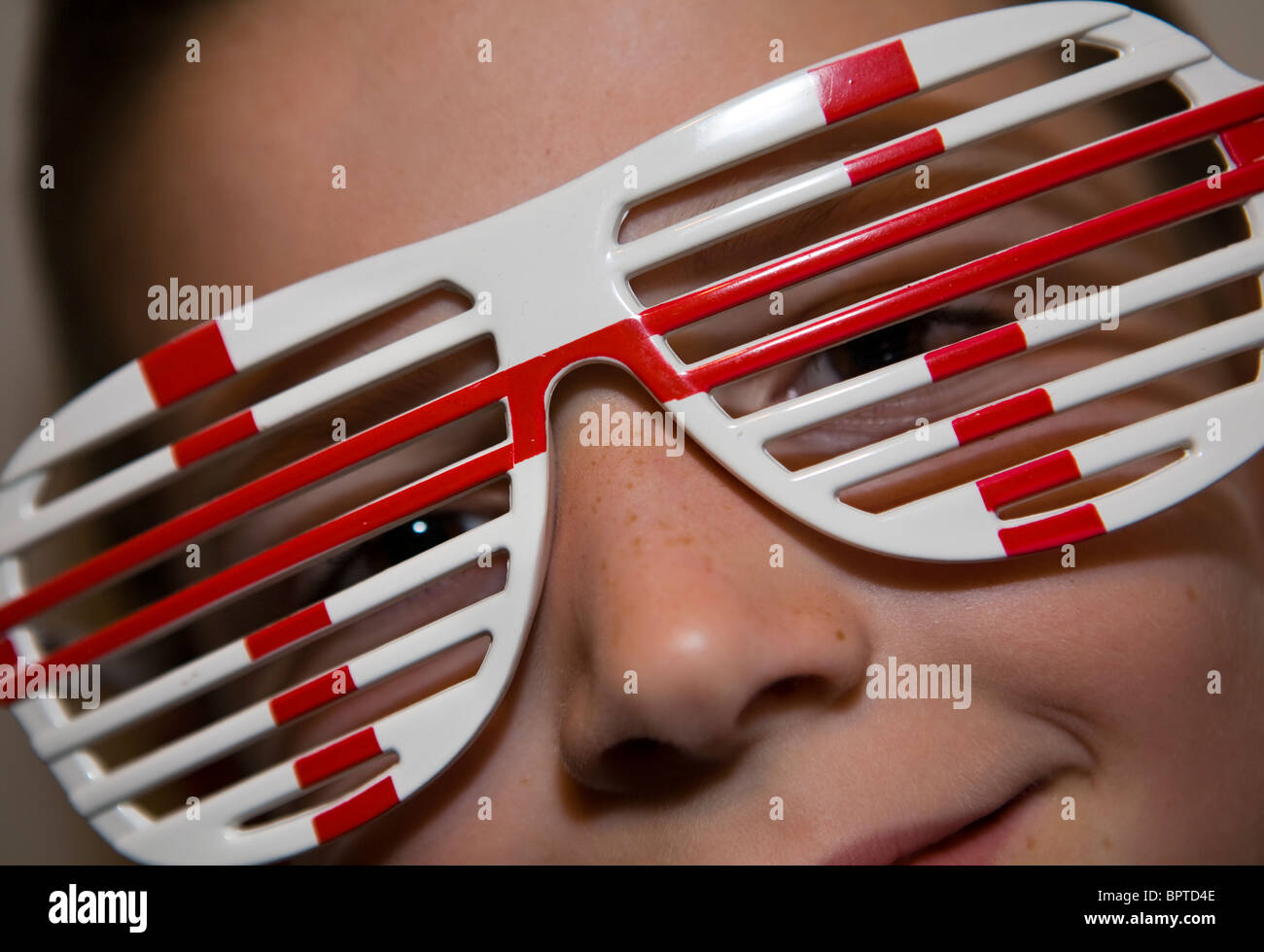Young boy, wearing England Sunglass, Shades, Sunglasses or Fun Specs or ...