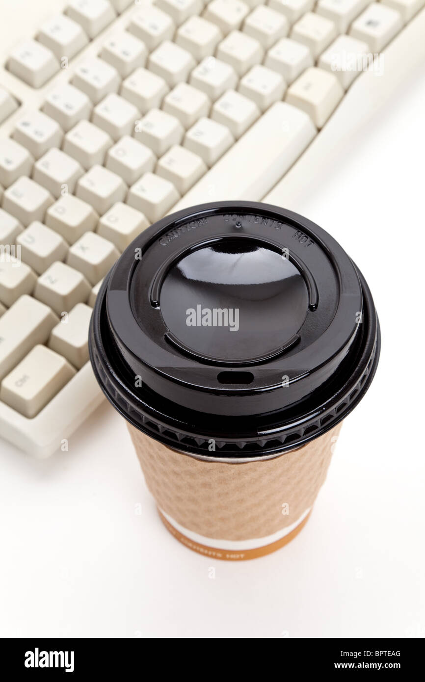 Disposable Coffee Cup and Computer Keyboard with white background Stock ...