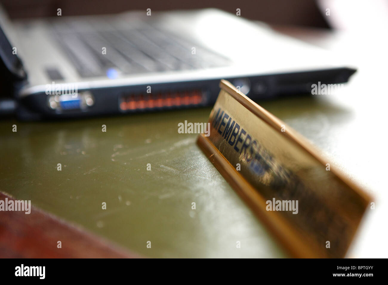 Laptop and membership sign in a club Stock Photo - Alamy