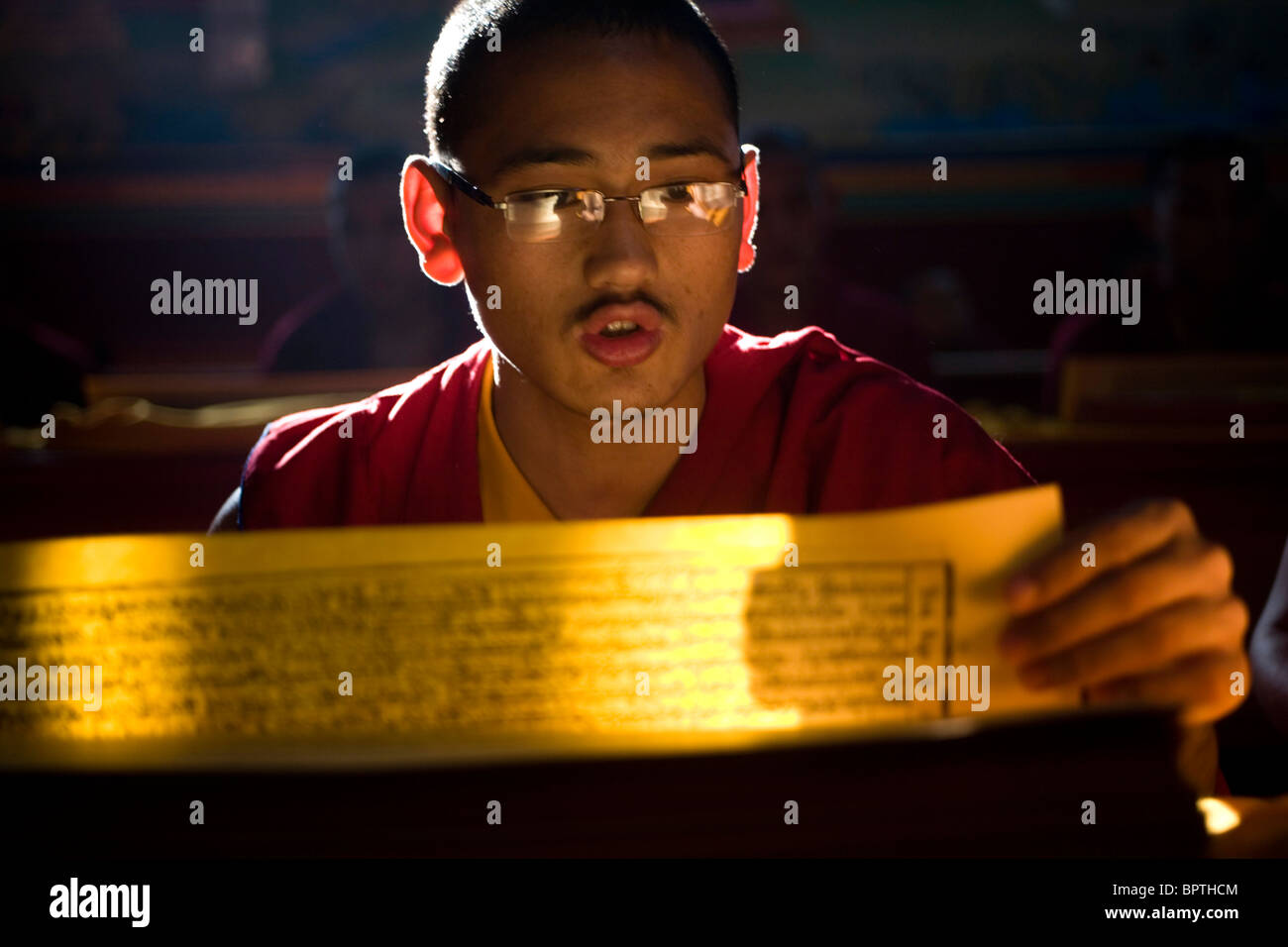 Young Tibetan Buddhist scholar reciting the Sutra in the monastry Vajra ...