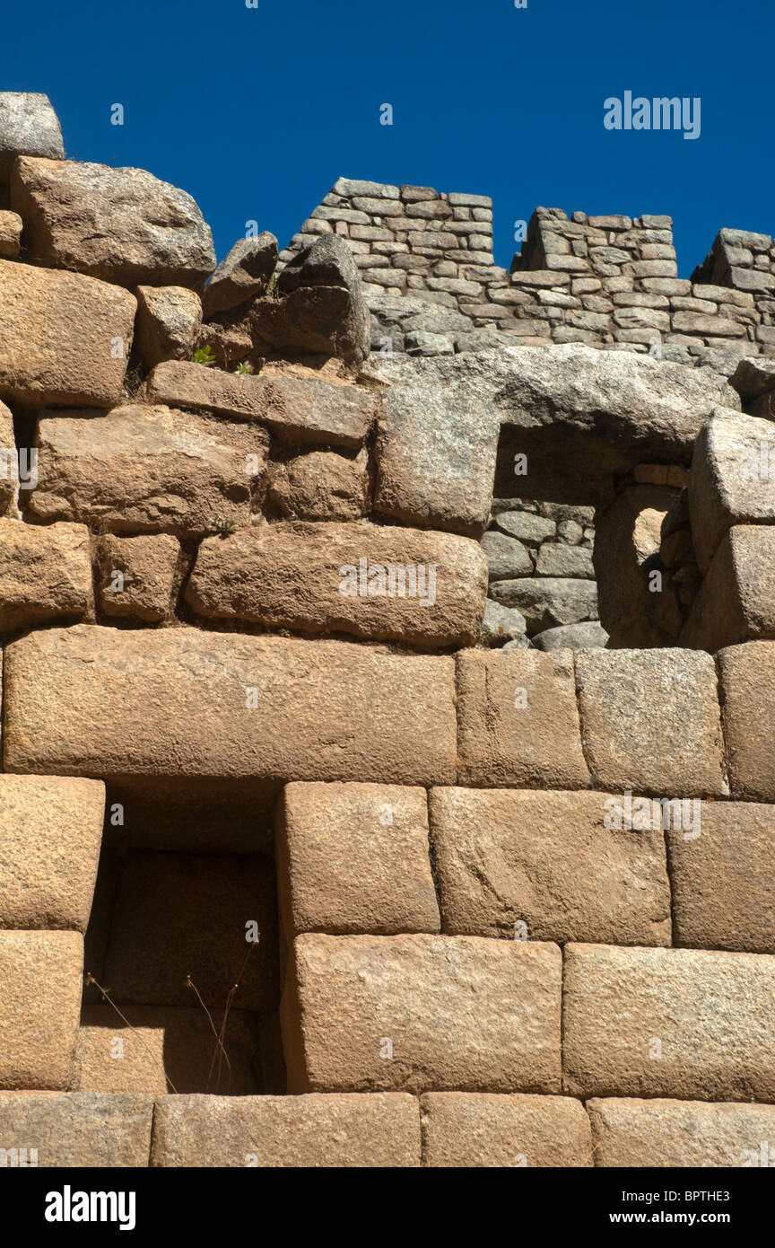 Intricate stonework of a reconstructed Sun Temple at the ancient Incan ...