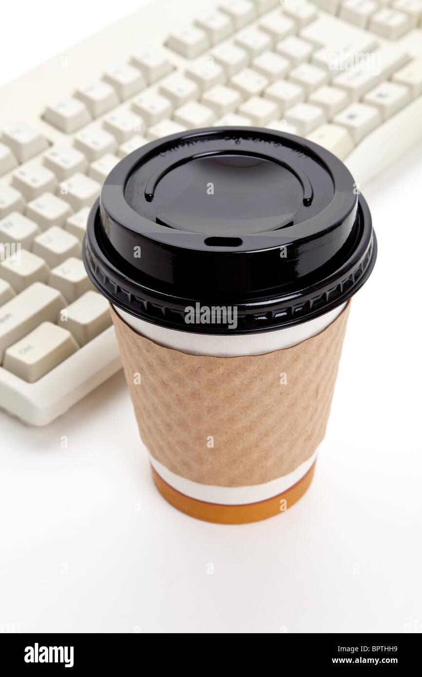Disposable Coffee Cup and Computer Keyboard with white background Stock ...