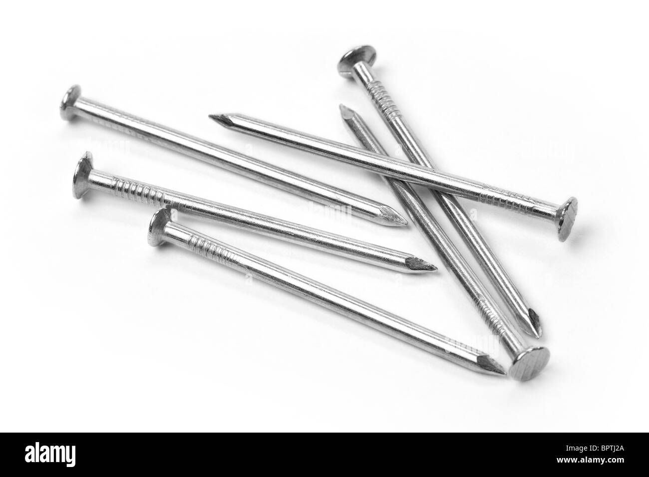 Metal nails with white background Stock Photo - Alamy