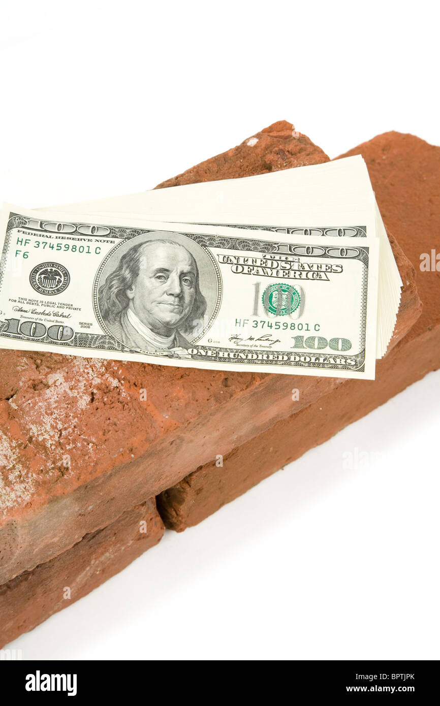 Red Brick and Dollar with white background Stock Photo - Alamy