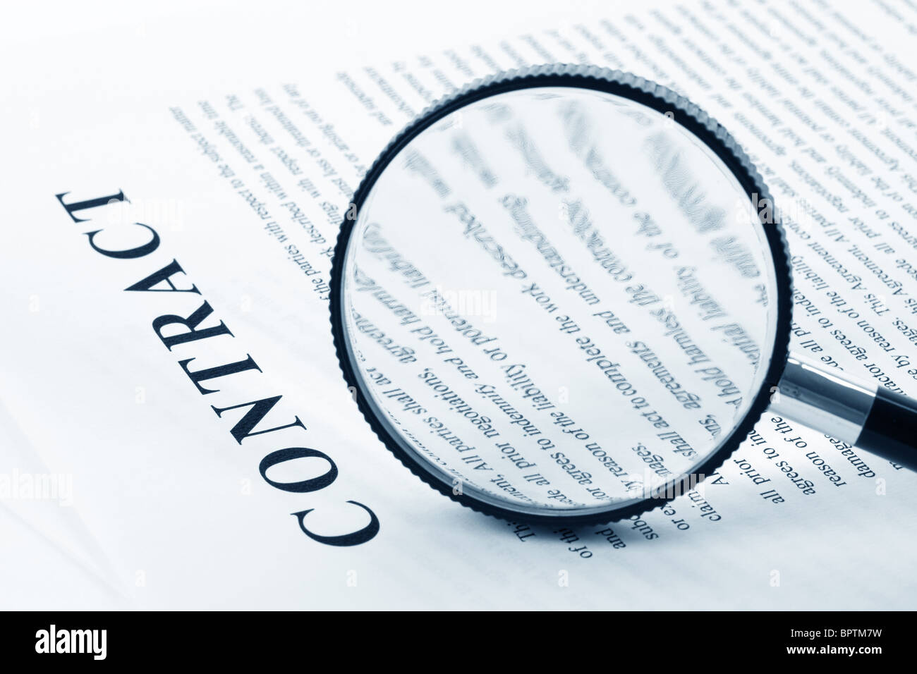 Magnifying Glass and document close up Stock Photo - Alamy