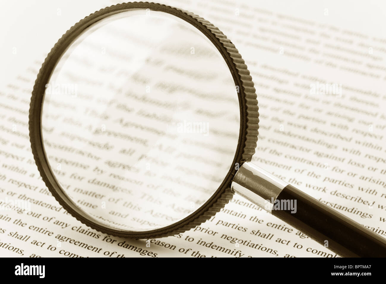 Magnifying Glass and document close up Stock Photo - Alamy