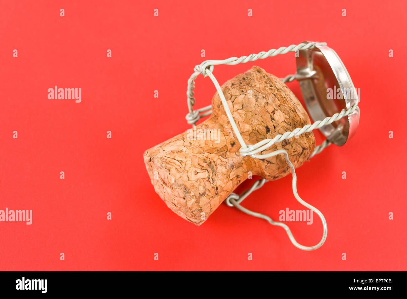 Champagne Cork Lid with red background Stock Photo - Alamy