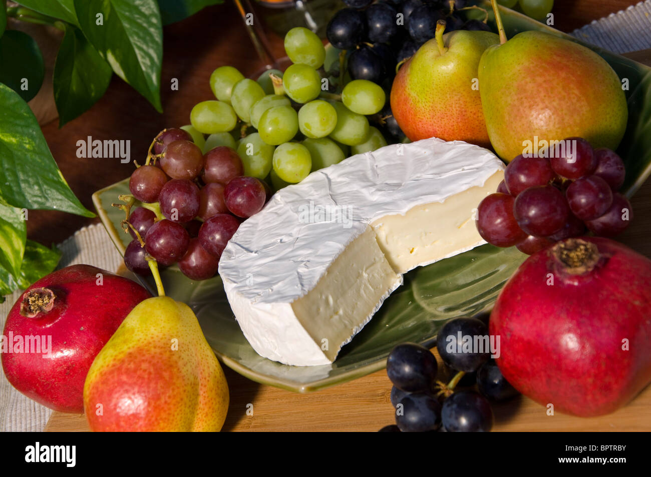 Cheese plate with grape and pear Stock Photo - Alamy