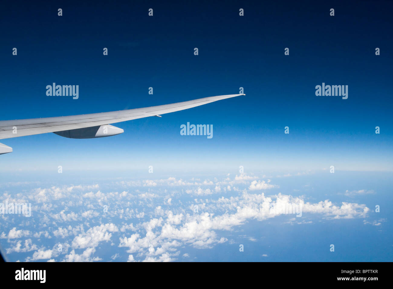 View of jet plane wing on a background of sky Stock Photo - Alamy