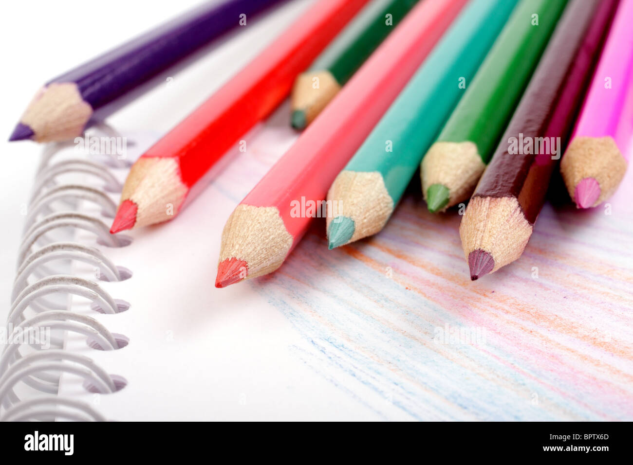 colored pencils on notepad Stock Photo - Alamy