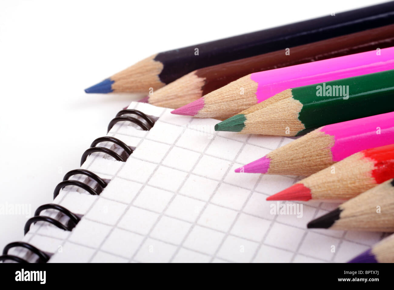 colored pencils on notepad Stock Photo - Alamy