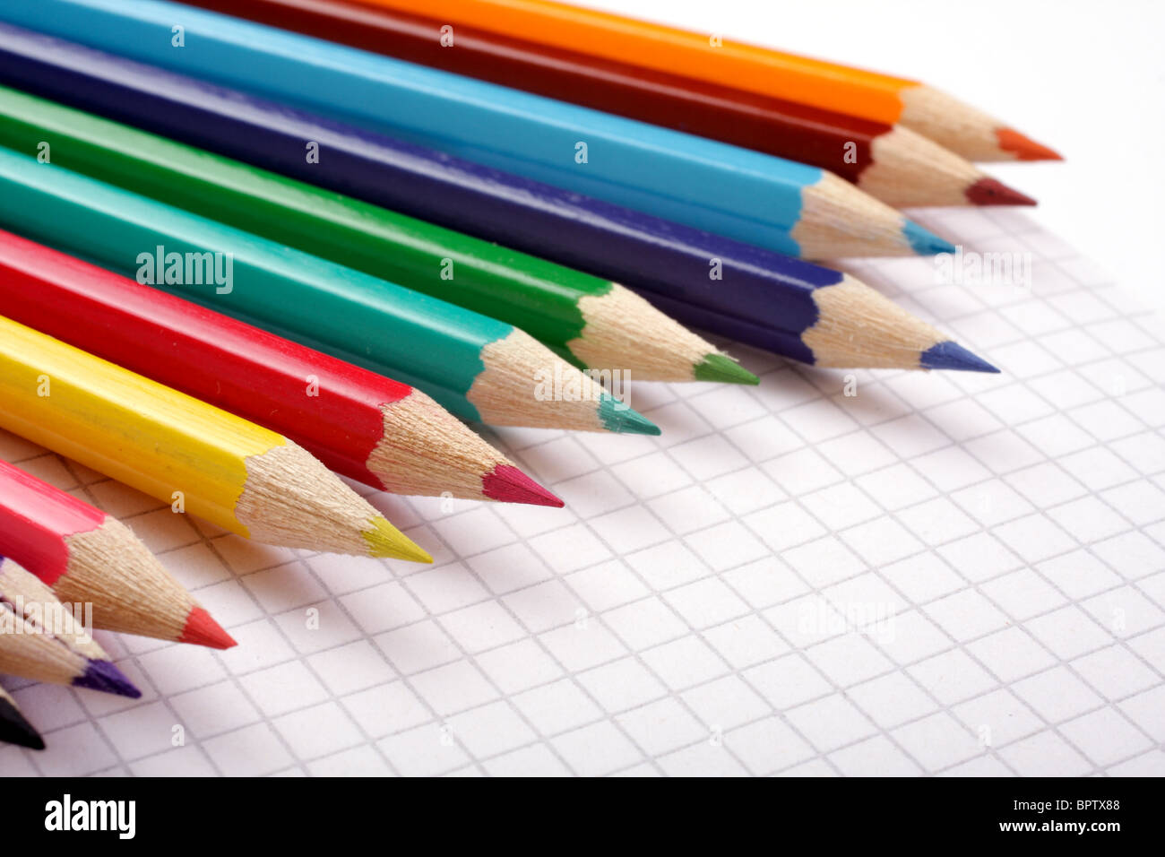 colored pencils on notepad Stock Photo - Alamy