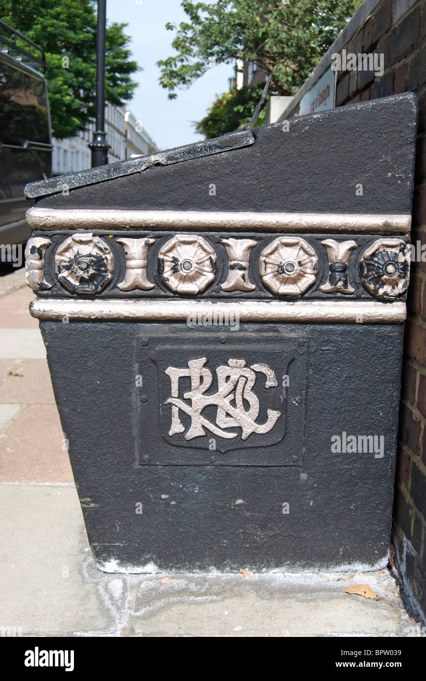 ornate road grit container displaying the insignia of the royal borough ...