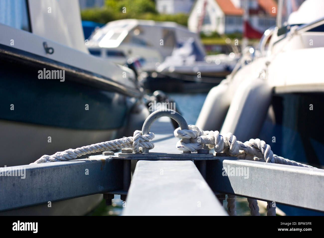 Boats in a marina tied by ropes in Asgardstrand, Norway Stock Photo - Alamy