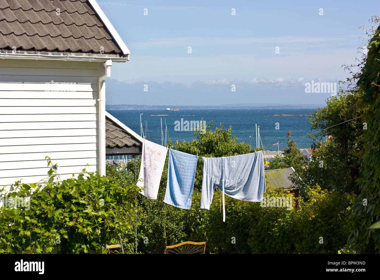 A washing line with the sea in the background in Asgardstrand, Norway ...