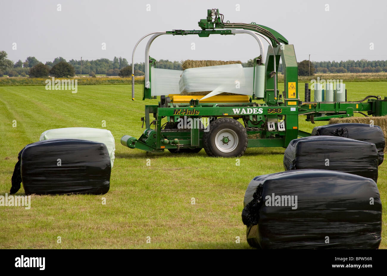 Hay bale wrapping machine hi-res stock photography and images - Alamy