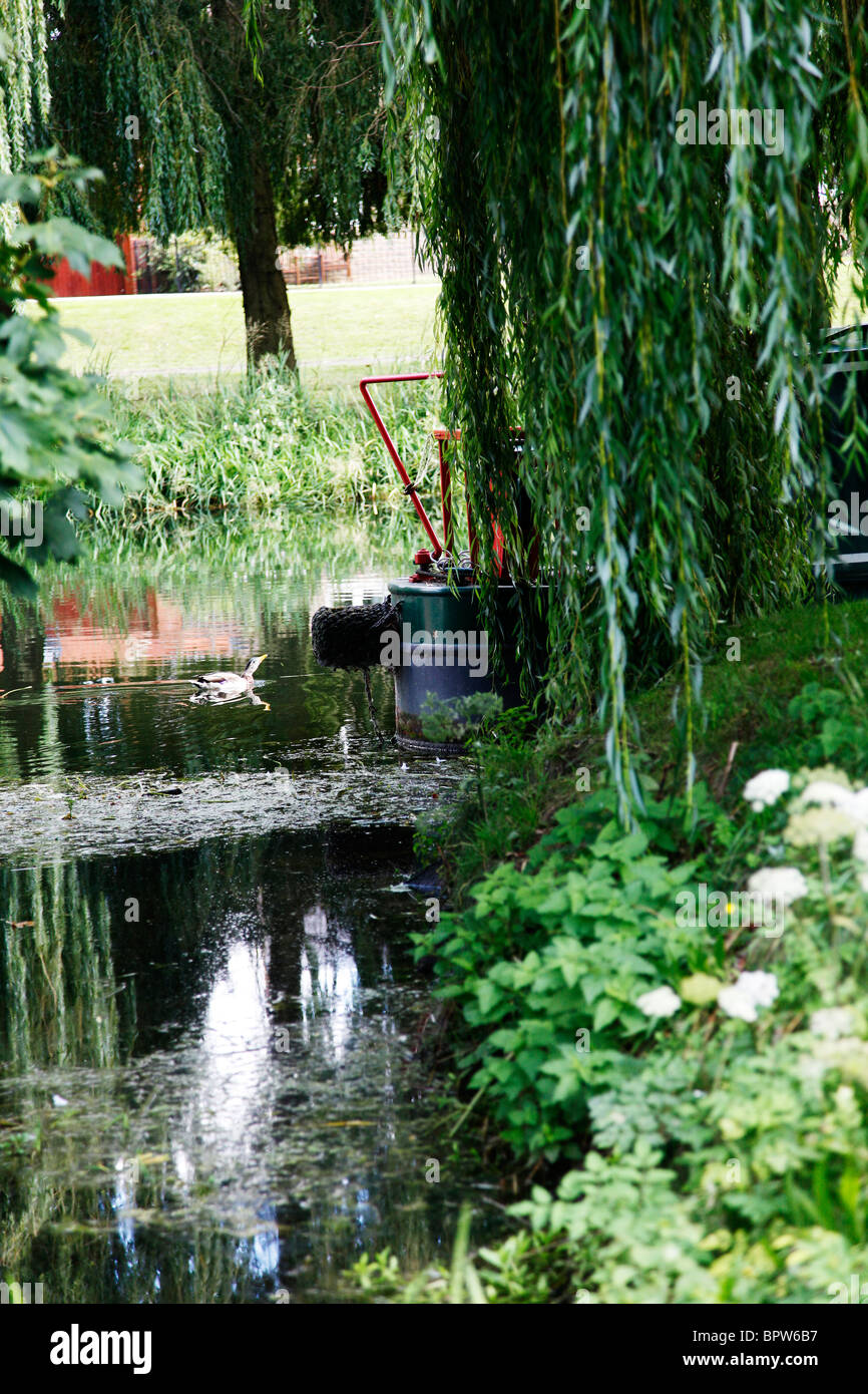 A tree shaded mooring for a canal boat on a summery day Stock Photo - Alamy