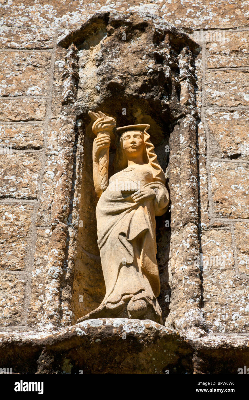 Figure in niche on the wall of the Church of St Candida and The Holy ...