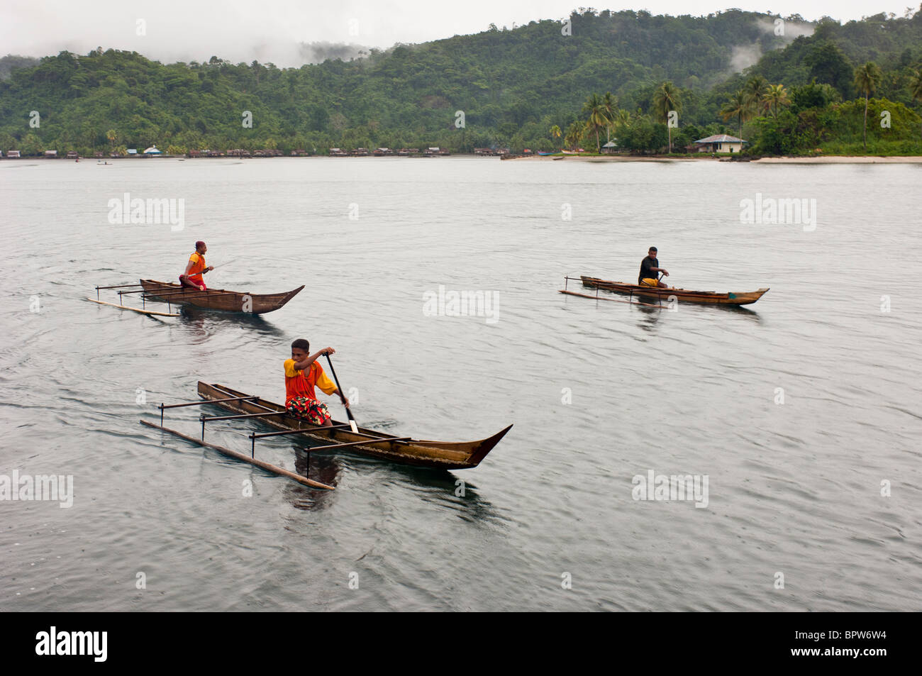 Dugout canoes in front of a traditional water village, Yapen, West ...