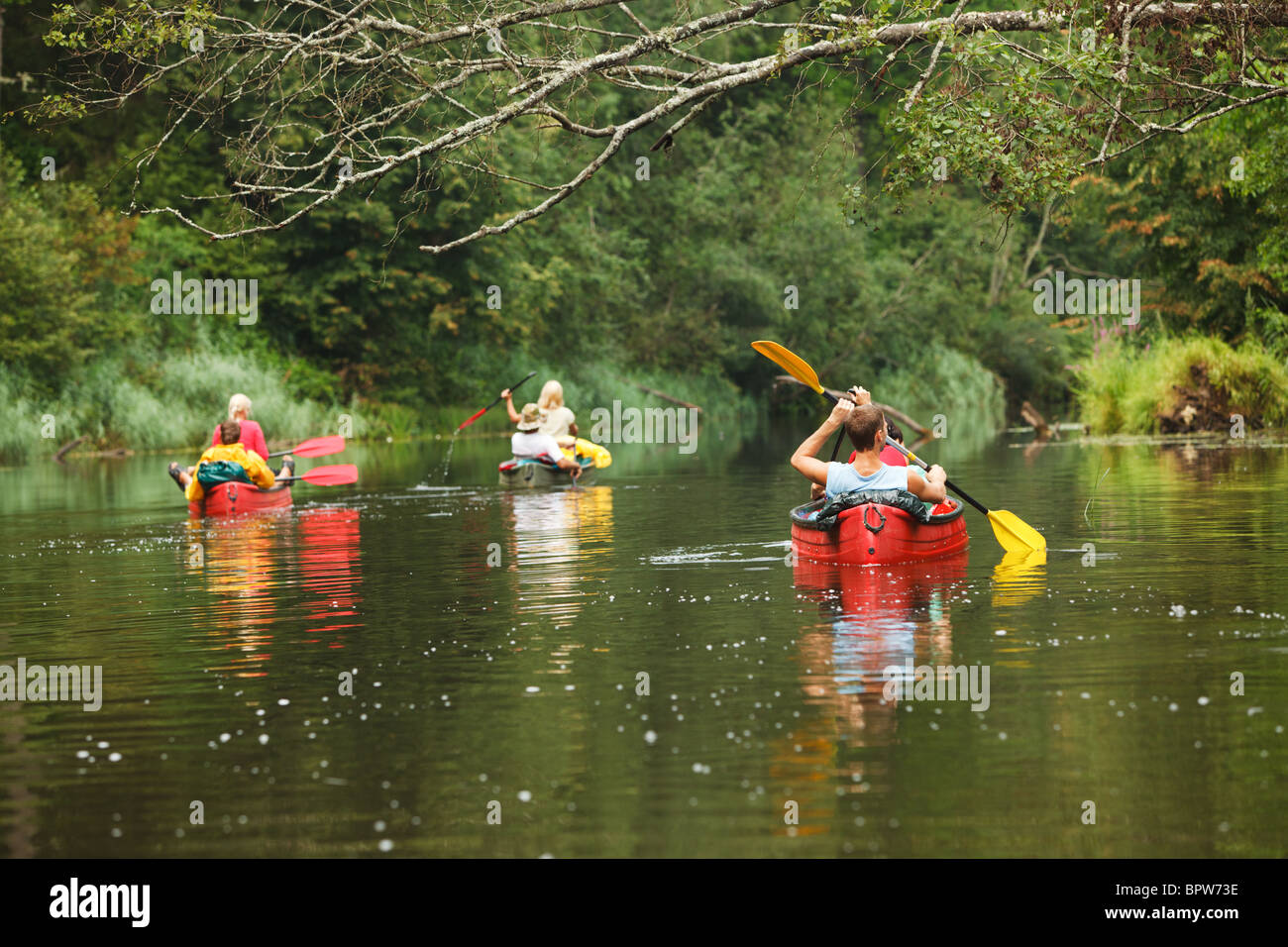 People boating on river Stock Photo - Alamy