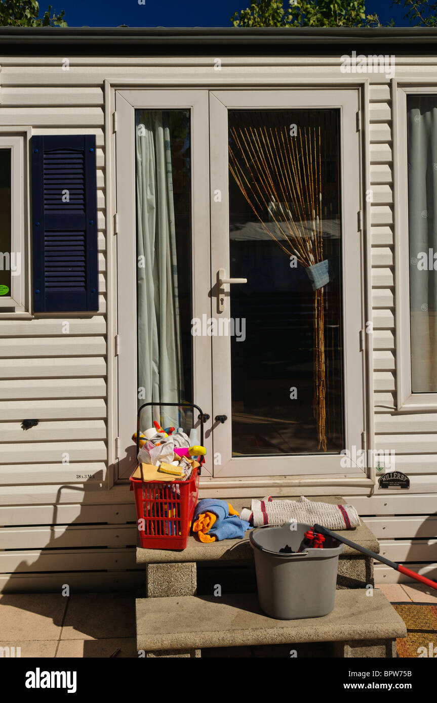 Cleaning equipment on the step of a static caravan Stock Photo - Alamy
