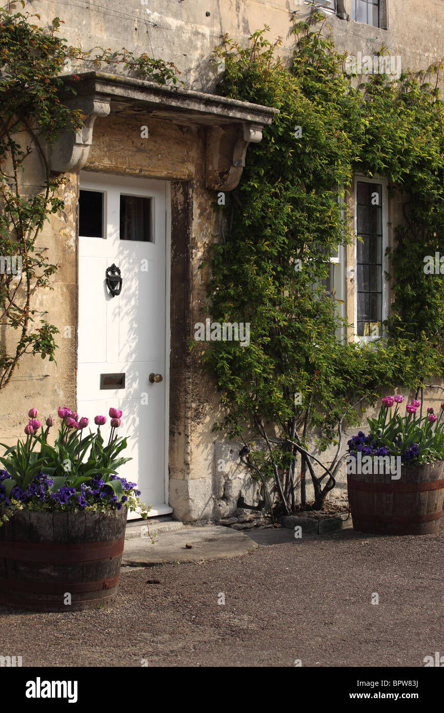 White front door of a house in Lacock High Street, Wiltshire, England ...
