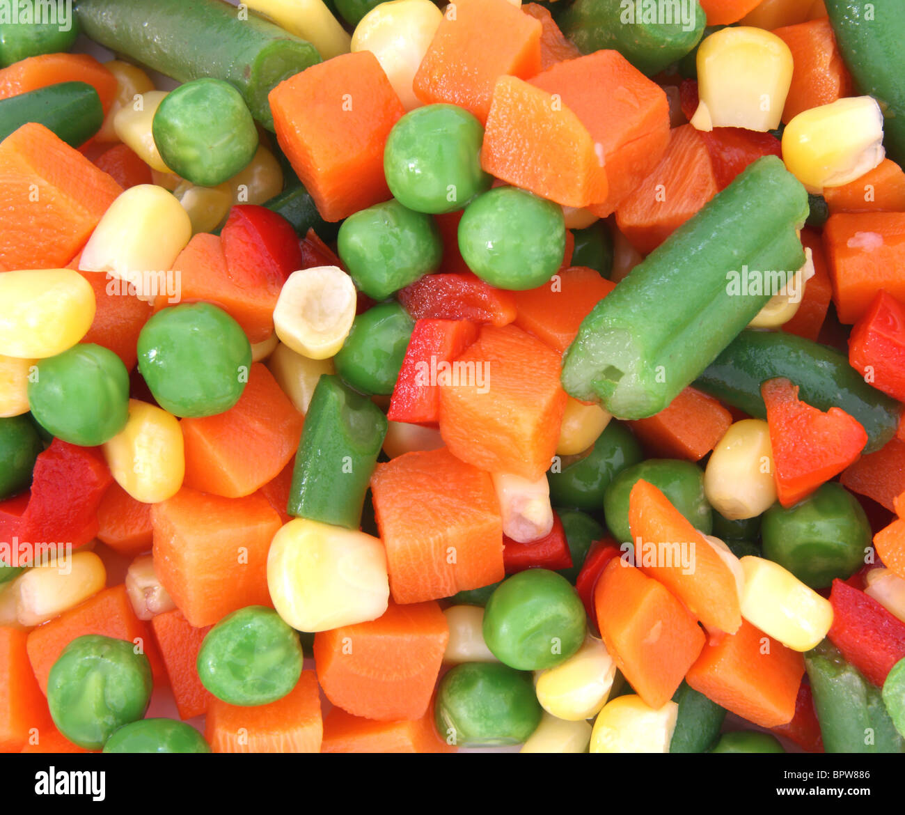 Colorful mix of cooked vegetable - pea, corn, carrot and green bean ...