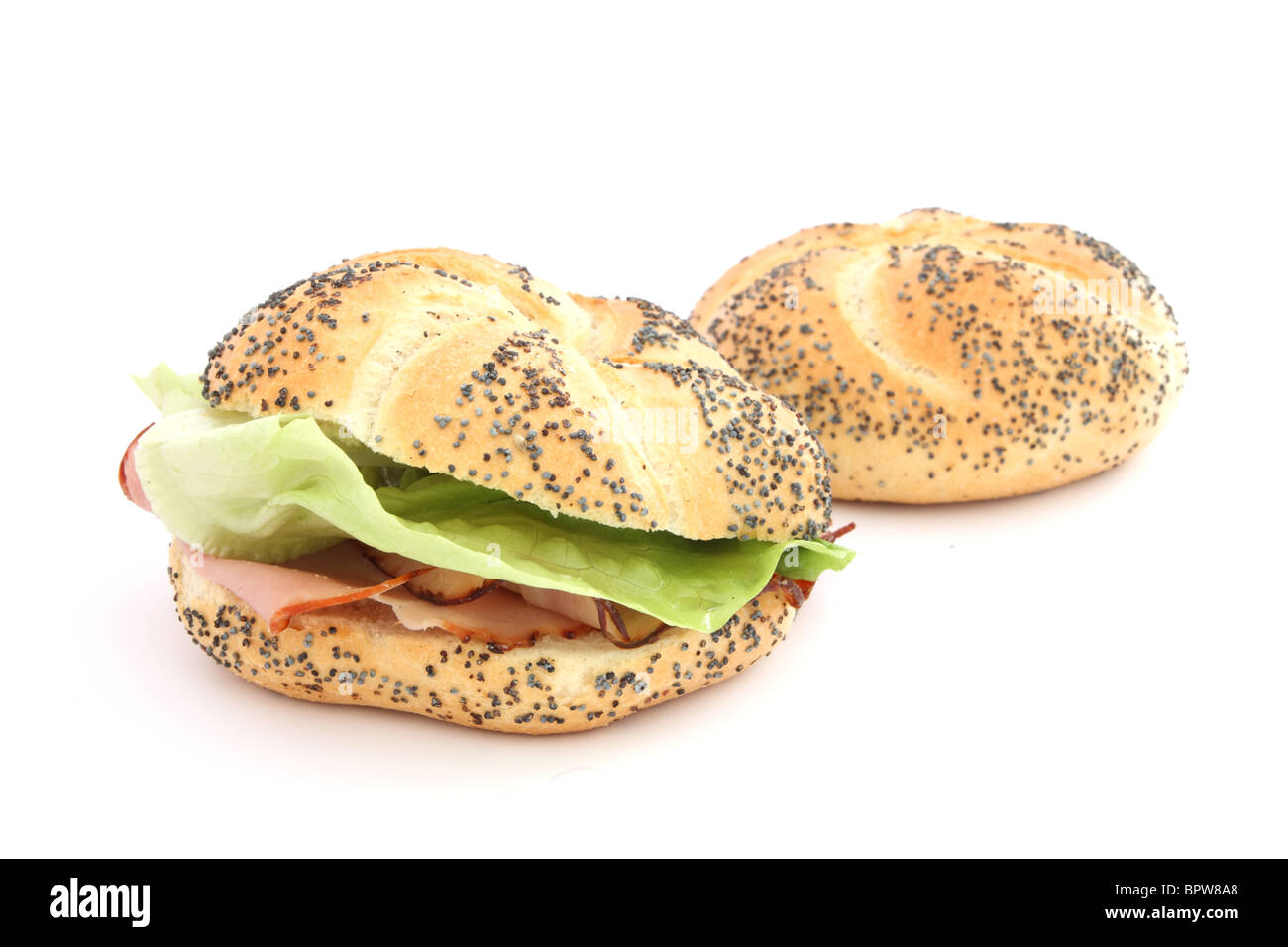 Sandwich made of bun with ham and lettuce on white background Stock ...