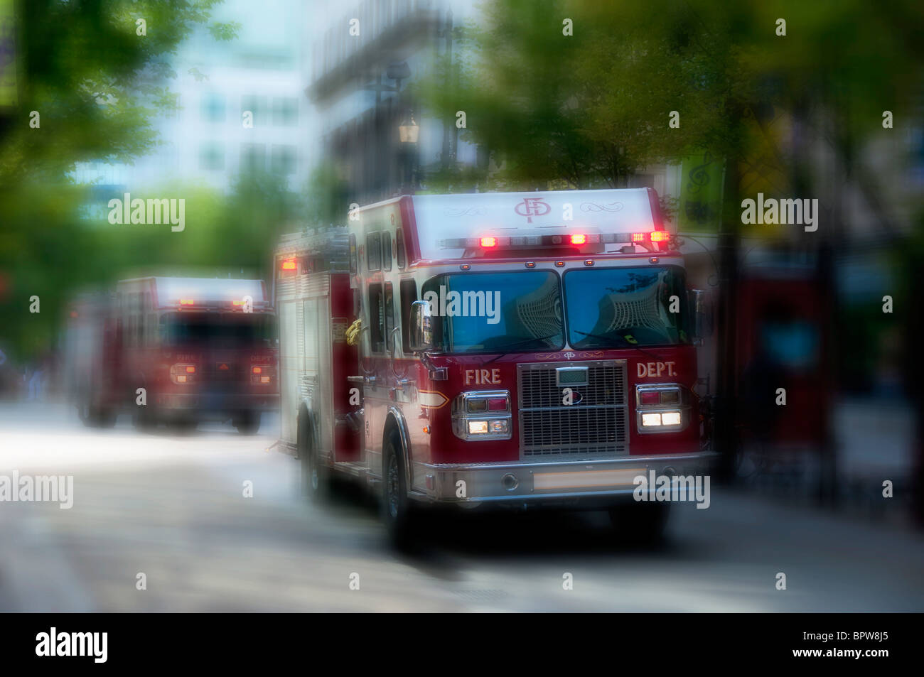 Calgary Fire Trucks on their way to help Stock Photo - Alamy