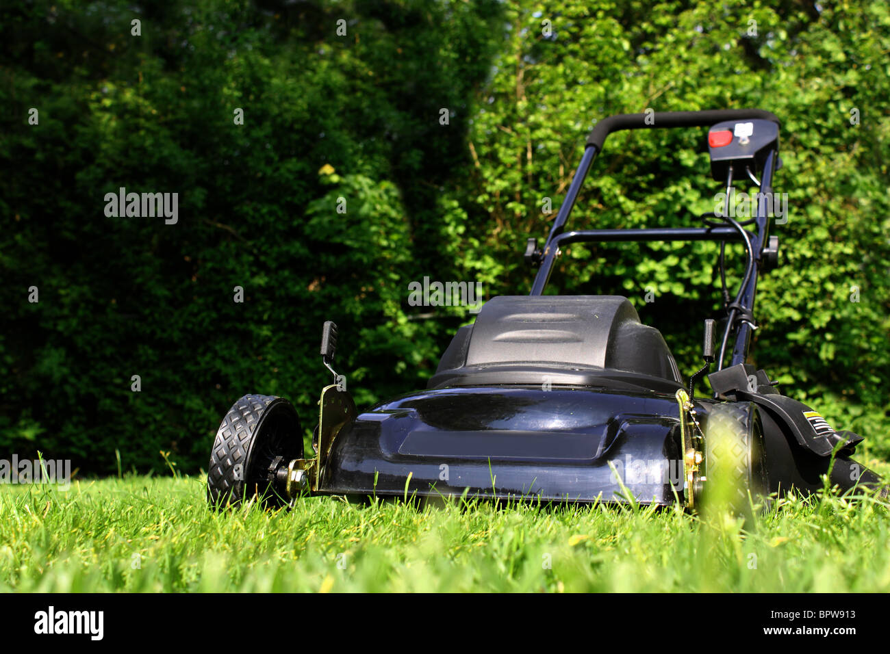 Black lawnmower ready to cut yard grass ( short depth of field Stock ...