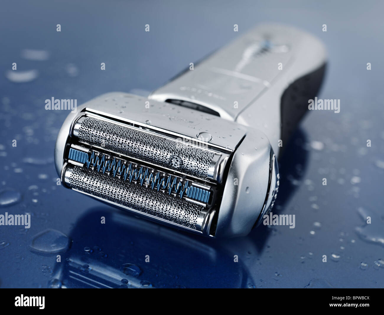 Braun 790CC - 9595 Pulsonic electric shaver on wet blue glass ...