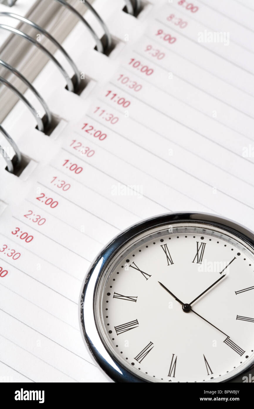 calendar and clock close up shot Stock Photo - Alamy