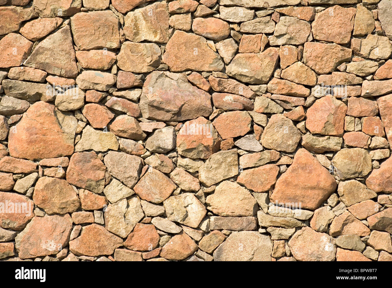 Yellow rock wall pattern for background Stock Photo - Alamy