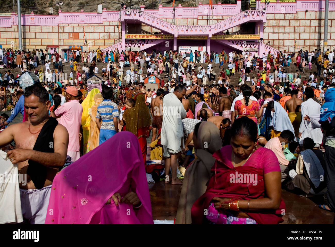 Pilgrims gathering along the Ganges river bank during the Kumbh Mela ...