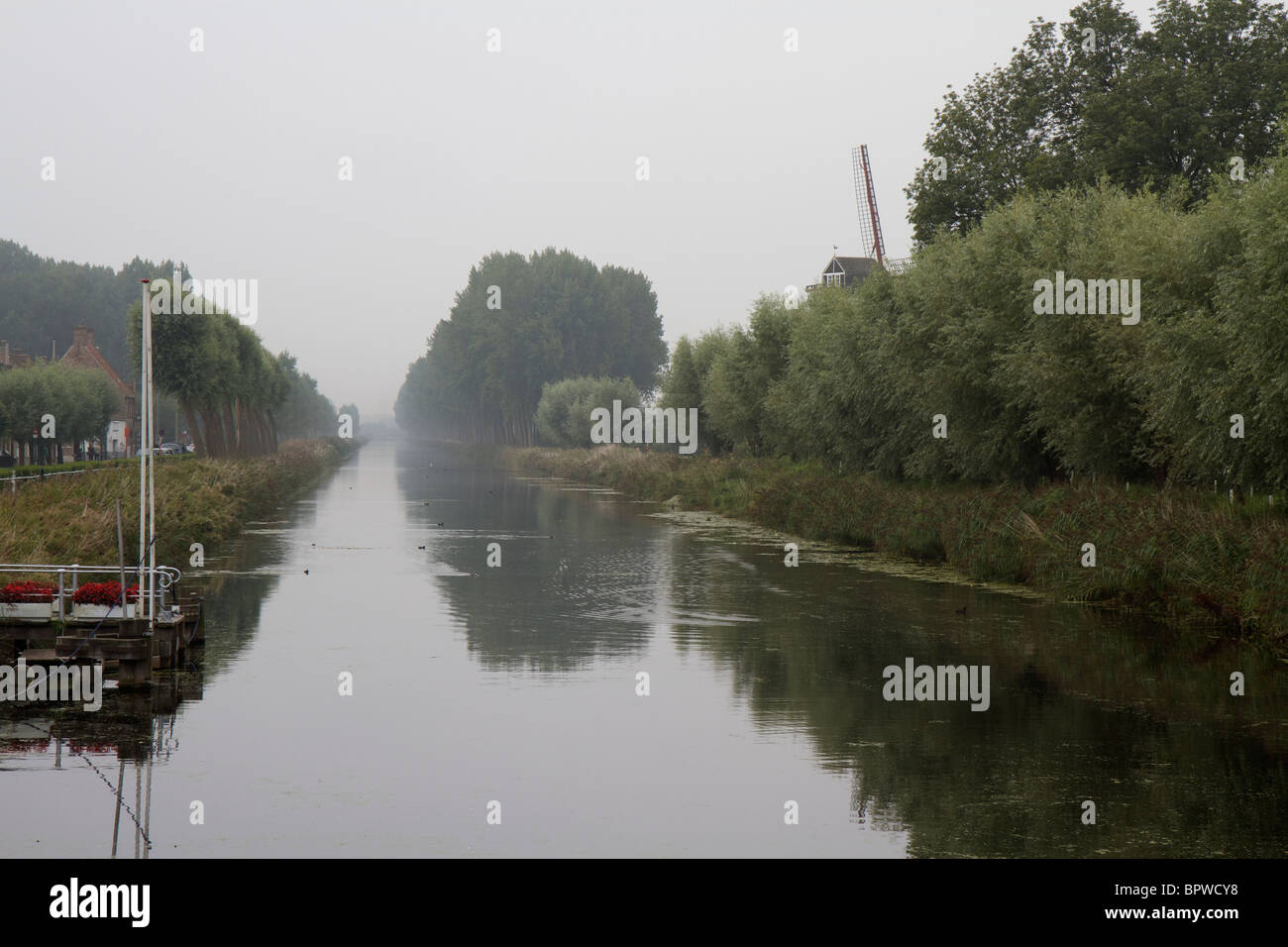 The tree lined Damse Vaart (Bruges-Sluis) canal at Damme in Belgium in ...