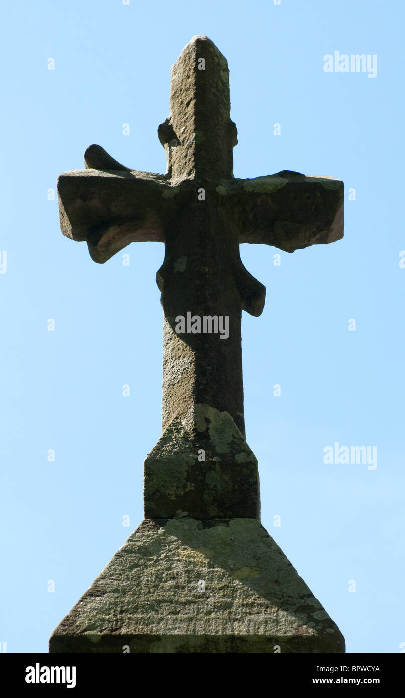 A Christian stone cross sits on a gable end of a Scottish church Stock ...