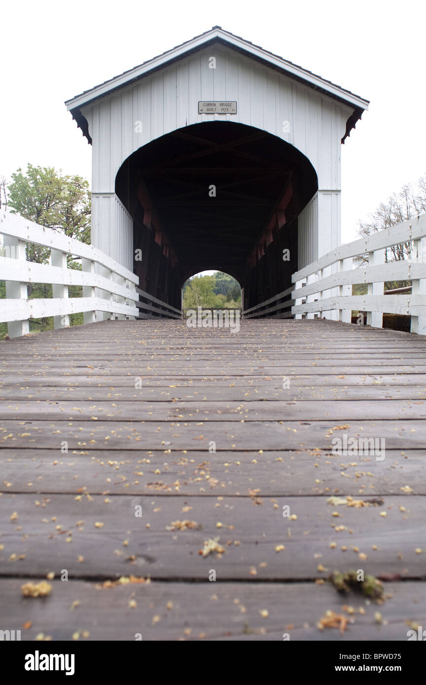 Looking head on to a covered bridge on an overcast day Stock Photo - Alamy
