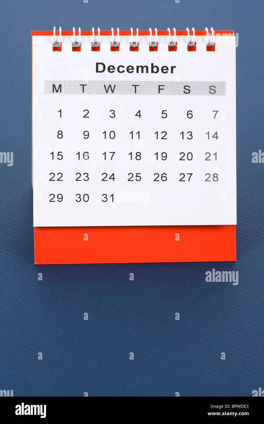 Calendar December close up with blue background Stock Photo - Alamy