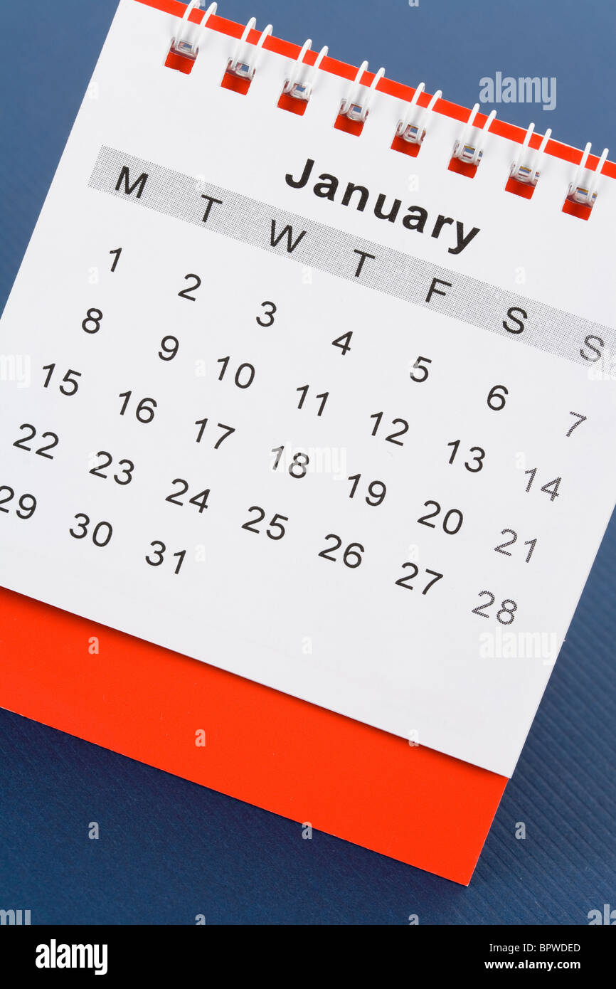 Calendar January close up with blue background Stock Photo - Alamy