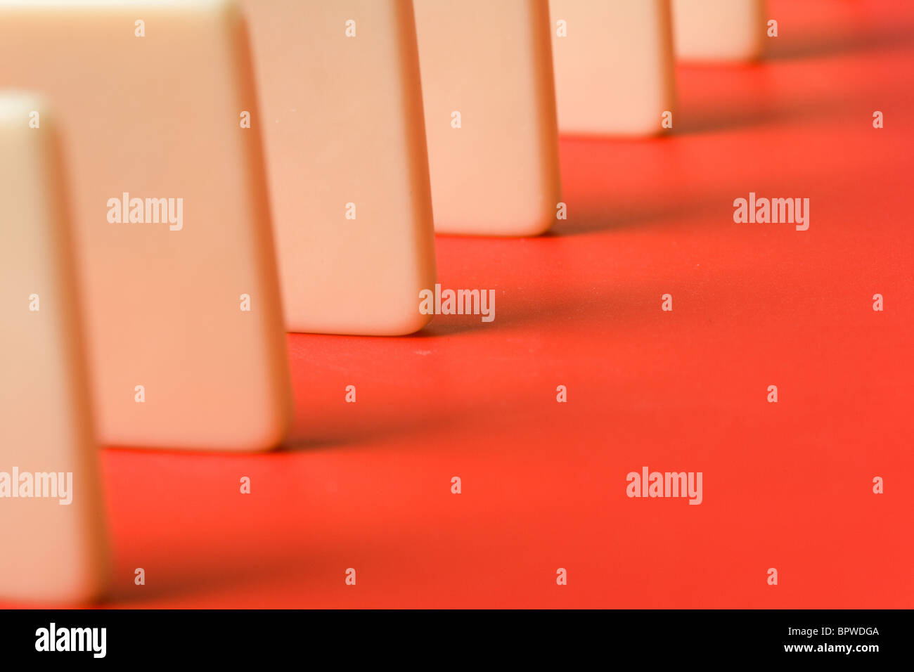 Domino with red background, Concept of Cause or Teamwork Stock Photo ...