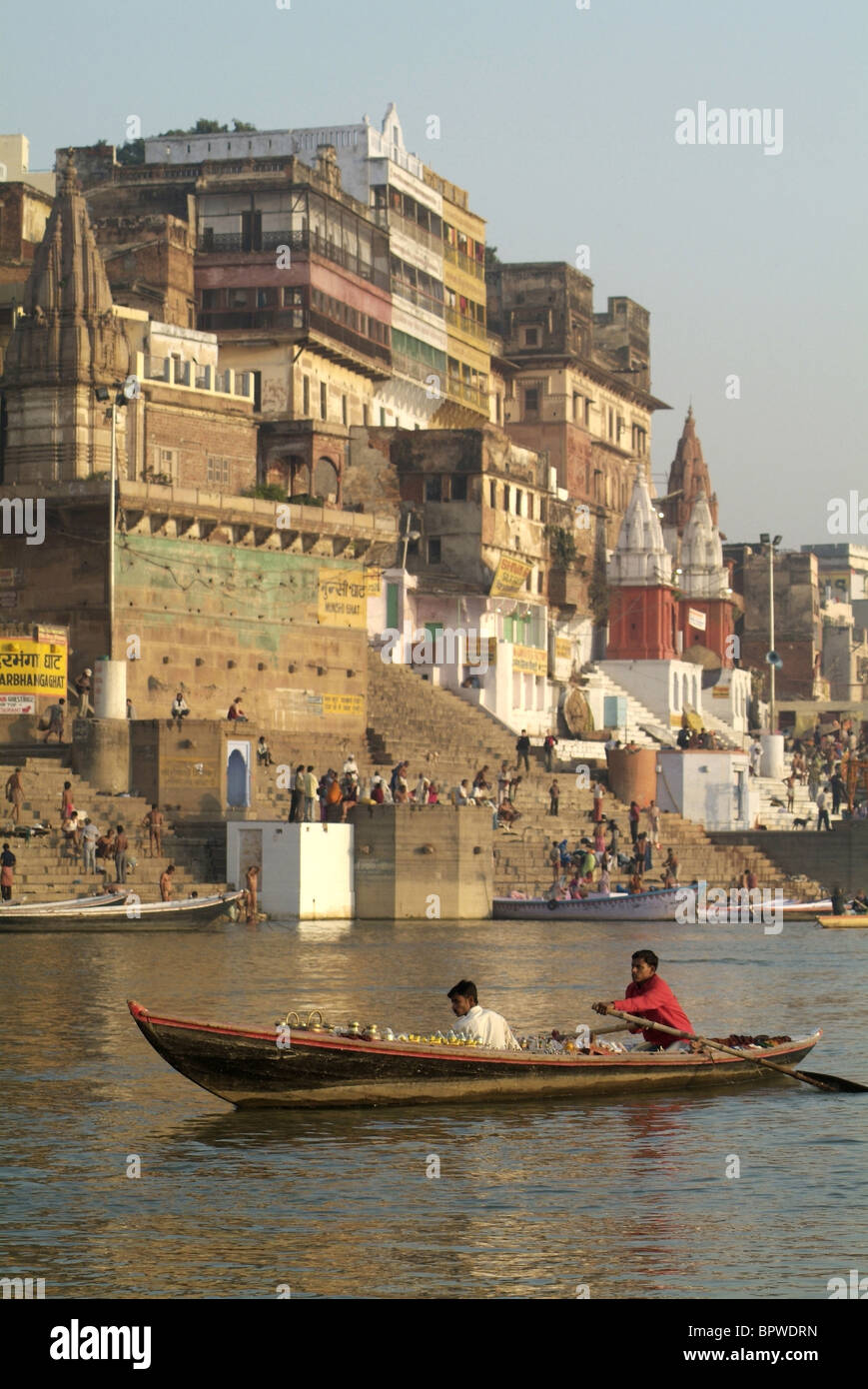 Two men in a boat on the Ganges River in Varanasi, India Stock Photo ...