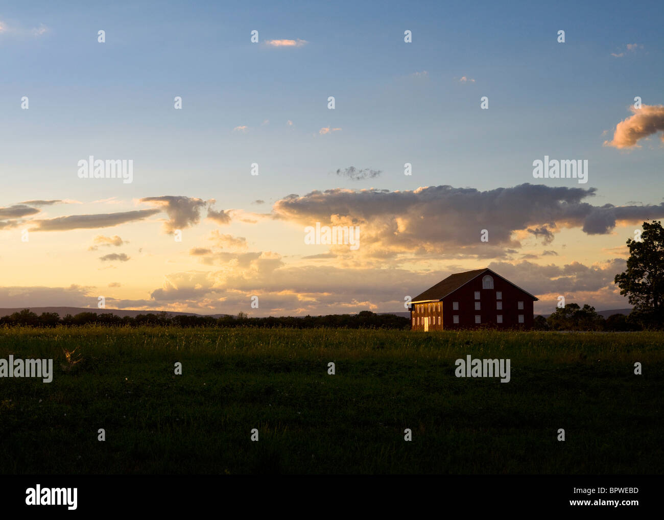 Farmhouse in sunset Stock Photo - Alamy