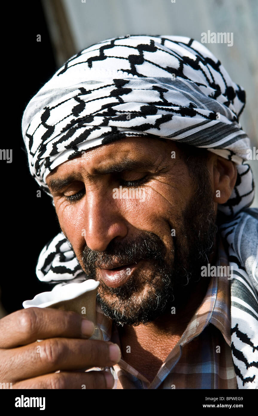 A Palestinian man enjoying a cup of Arabic coffee Stock Photo - Alamy