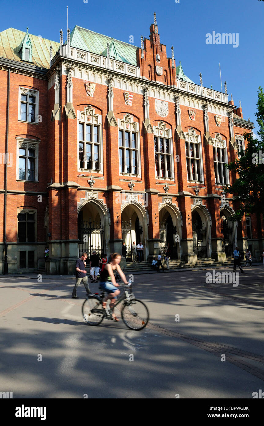 Cyclist passing the Collegium Novum This neo Gothic building was built ...