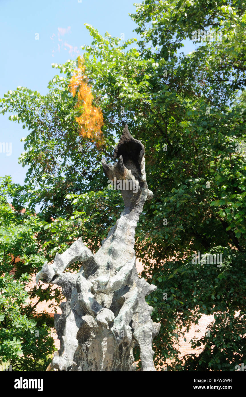 Dragon statue breathing fire at the Dragon's lair at Wawel Hill in ...