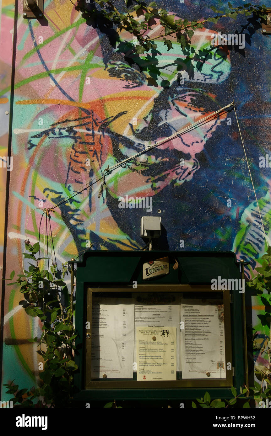 Graffiti + menu in Berlin Stock Photo - Alamy