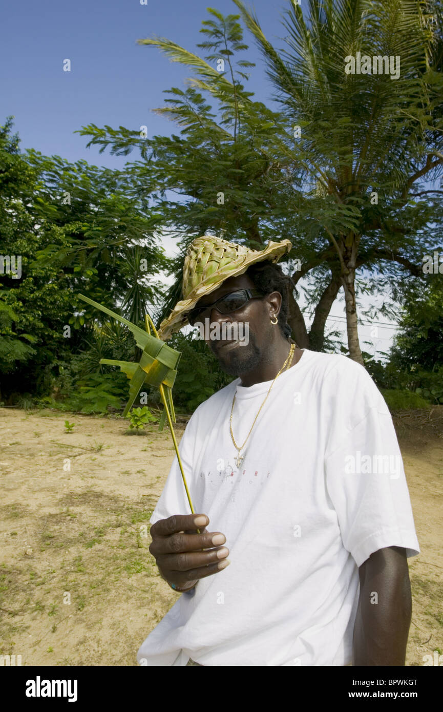 David Zephyrin making an Angel fish from a palm leaf on Mullins Beach ...
