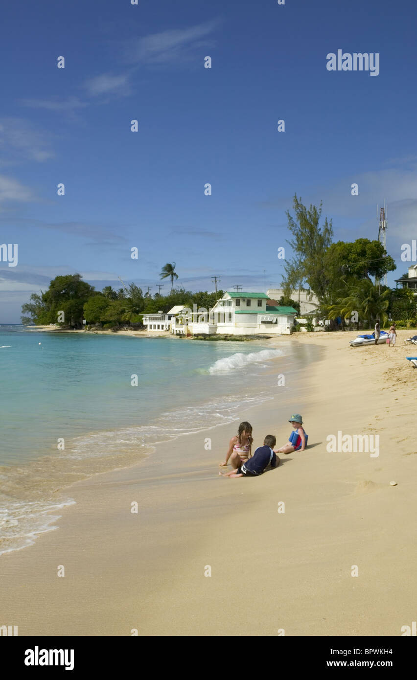 People relaxing on Mullins Beach along Mullins Bay in Barbados in the ...
