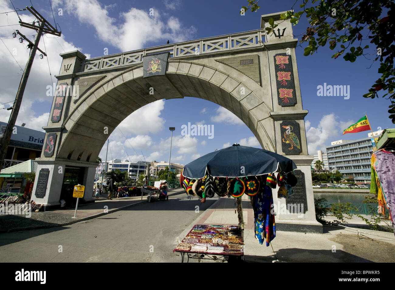 Souvenir stalls under Independence Arch built in 1987 Stock Photo - Alamy